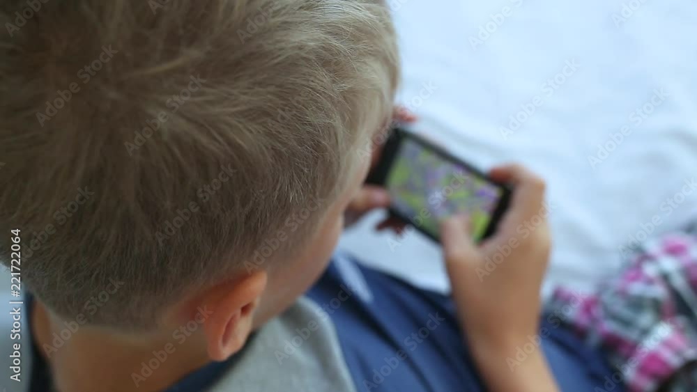 Top view closeup video of cute happy young kid of school age playing ...