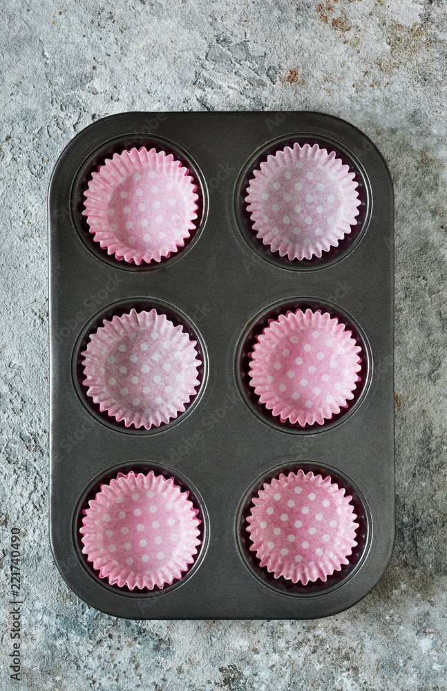 Concrete food background. Form for the preparation of muffins ...