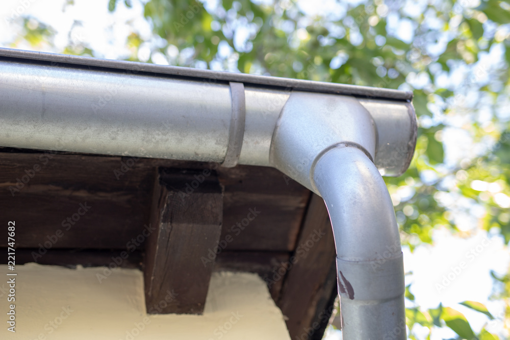 Gutter draining rainwater. The building is equipped with drainage of ...