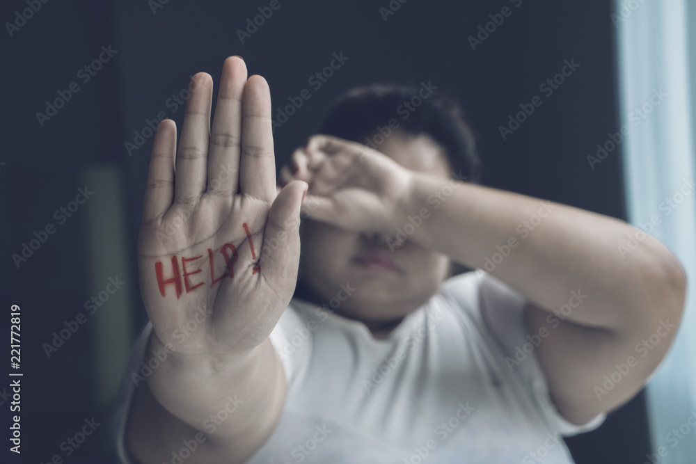 Sad fat woman showing help word Stock Photo | Adobe Stock
