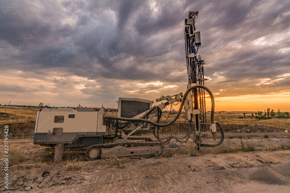 Drilling rock in the works of creating a road Stock Photo | Adobe Stock