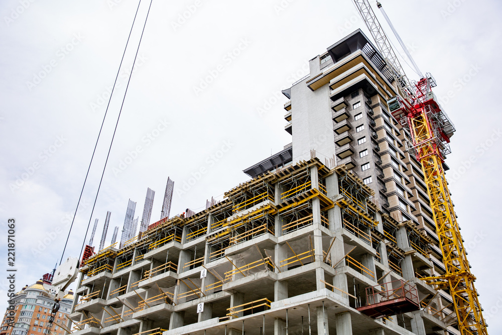 inside building sites under construction and cranes with blue sky ...