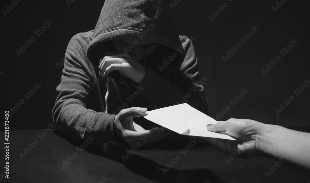 Businessman giving bribe money to partner in a corruption scam with ...