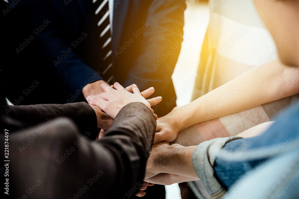 business people team showing unity with their hands together expose the ...