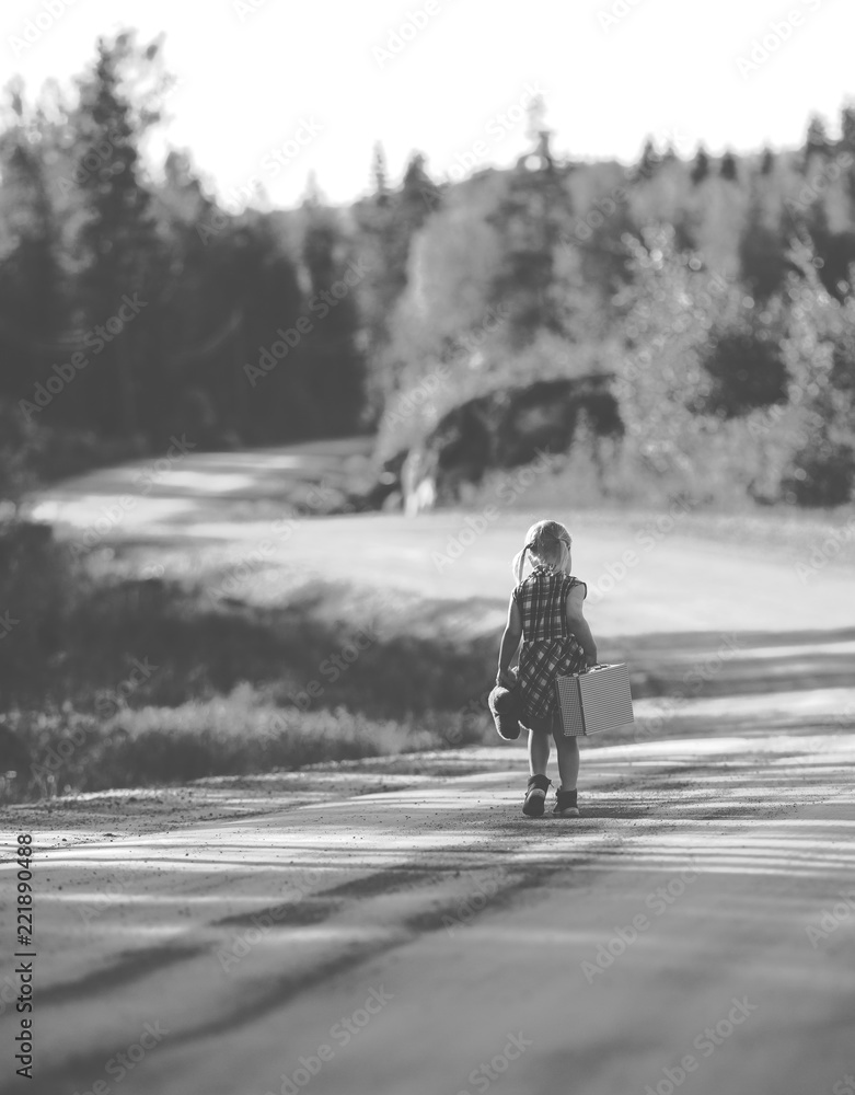 Runaway child concept image. Caucasian girl child walking a curvy road ...