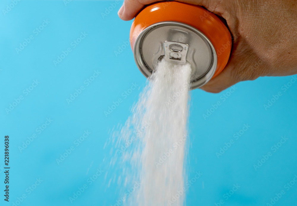 Hand holding soda can pouring lots of sugar in metaphor of sugar ...