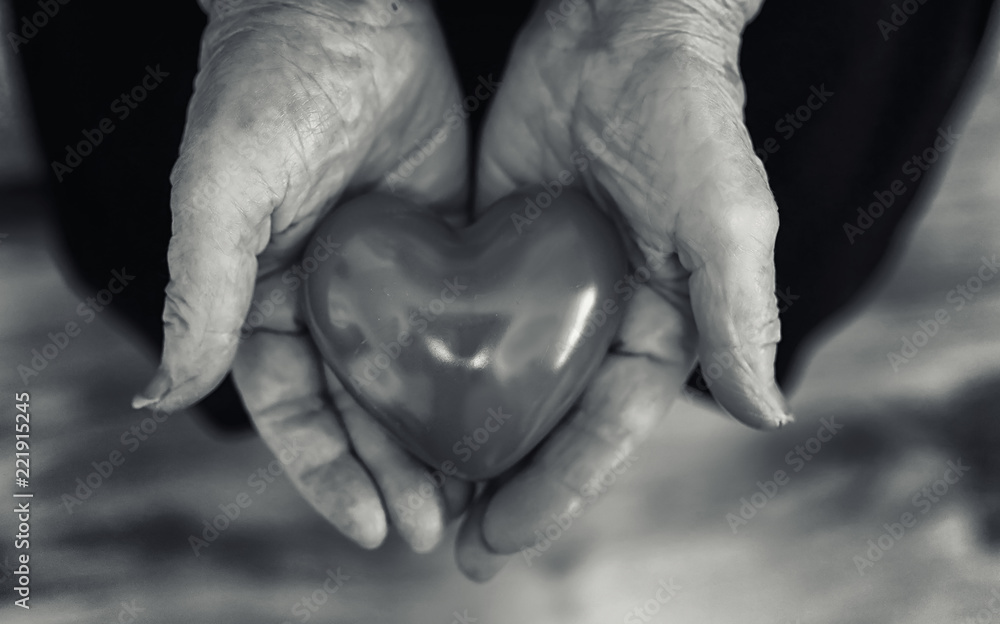 elder woman holding heart Stock Photo | Adobe Stock