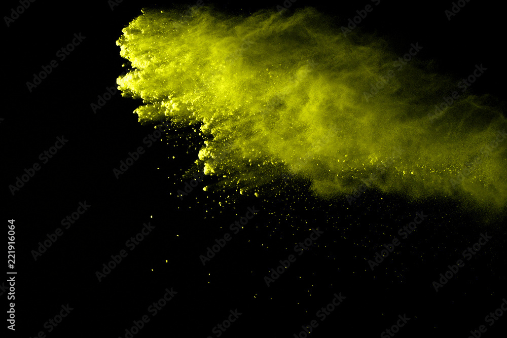 Abstract of yellow powder explosion on black background. Yellow powder ...