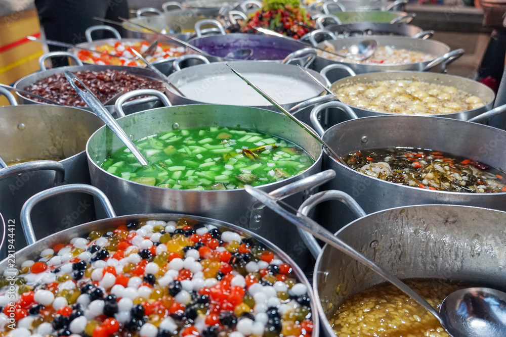 Large pots full of traditional Asian dessert jellies, sweet beans, and ...