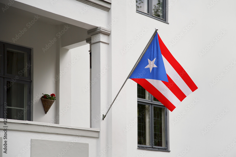 Puerto Rico flag. Puerto Rican flag hanging on a pole in front of the ...