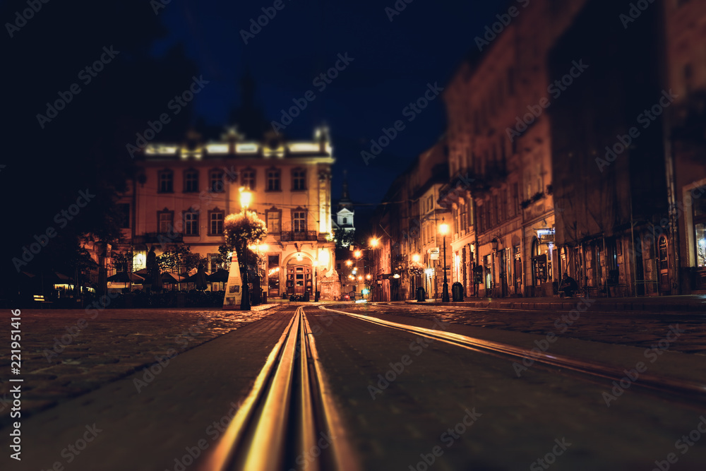 Old European city pedestrian street night city lights. Old ...