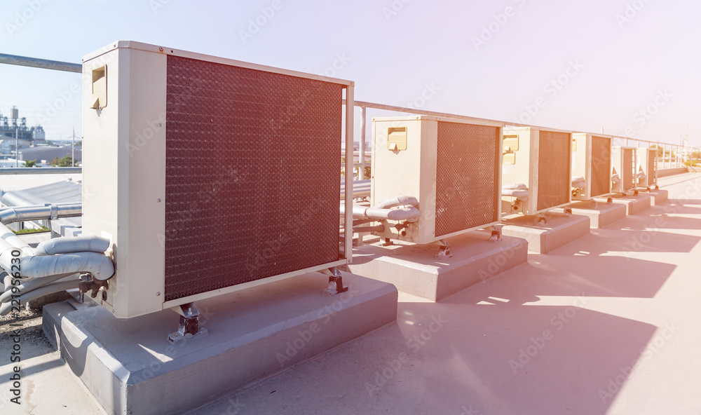 Air compressor machine part of air conditioner system on roof deck with ...