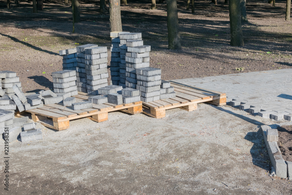 Installation of paving slabs. Works on the arrangement of the park ...