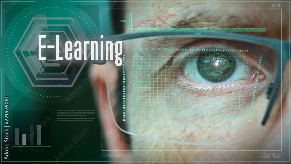 A close up of a businessman eye controlling a futuristic computer system with an E-Leanring ...