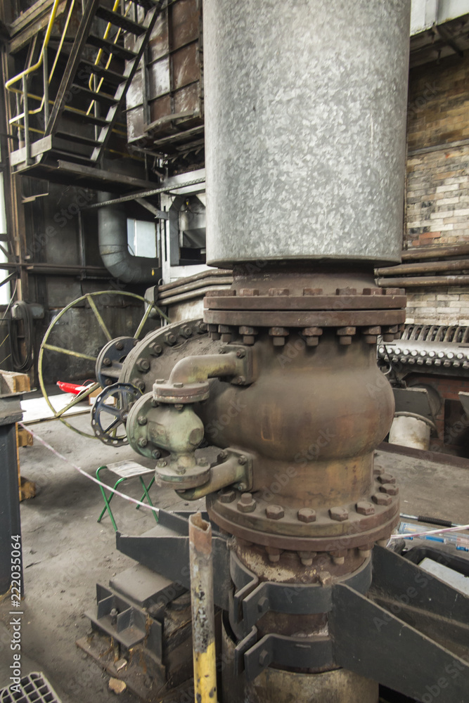An old large gate valve with a relief valve Stock Photo | Adobe Stock