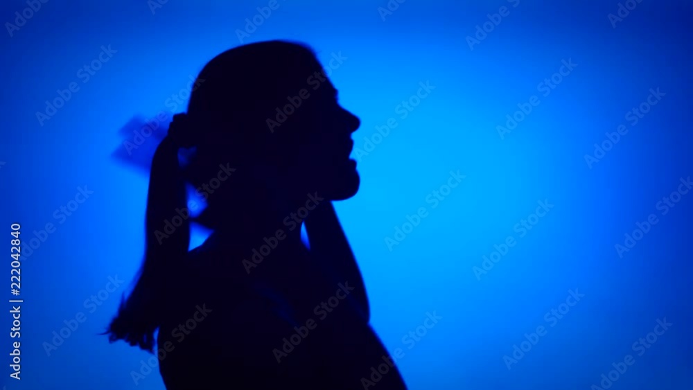 Silhouette of young frustrated woman crying. Female's face in profile ...