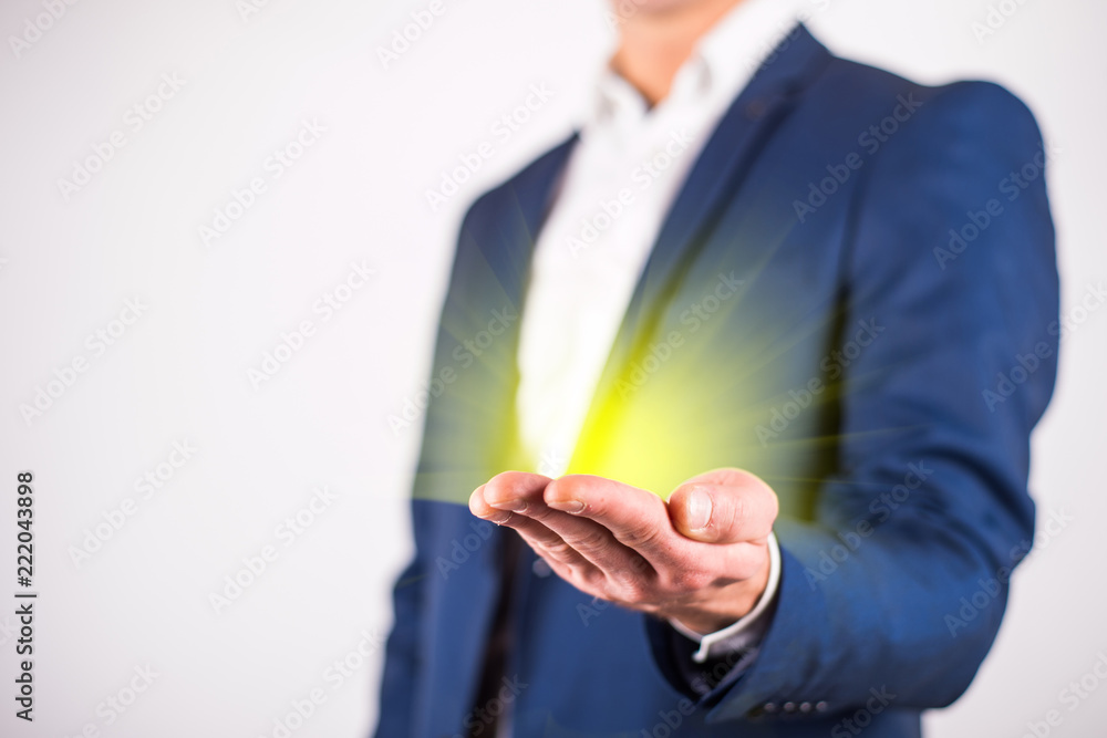 Yellow light on the palm of your hand. Concept of ideas and hopes Stock ...