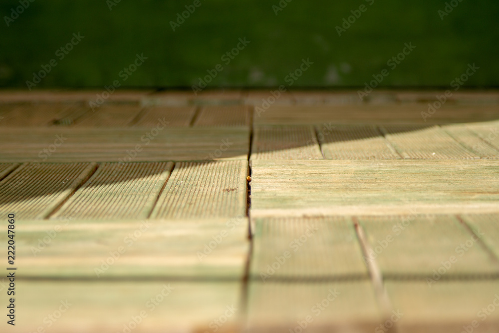 Shabby green beach flooring. Corrugated wooden floor on the beach ...