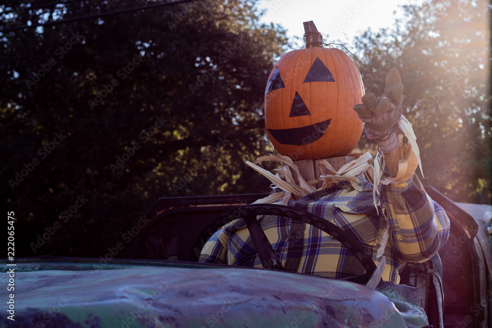 Smiling, happy, welcoming, fun friendly pumpkin head scarecrow driving ...