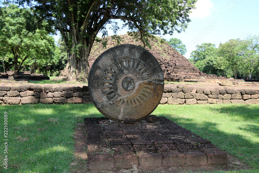 Stone carving of the wheel of the dharma. in archaeological site of ...