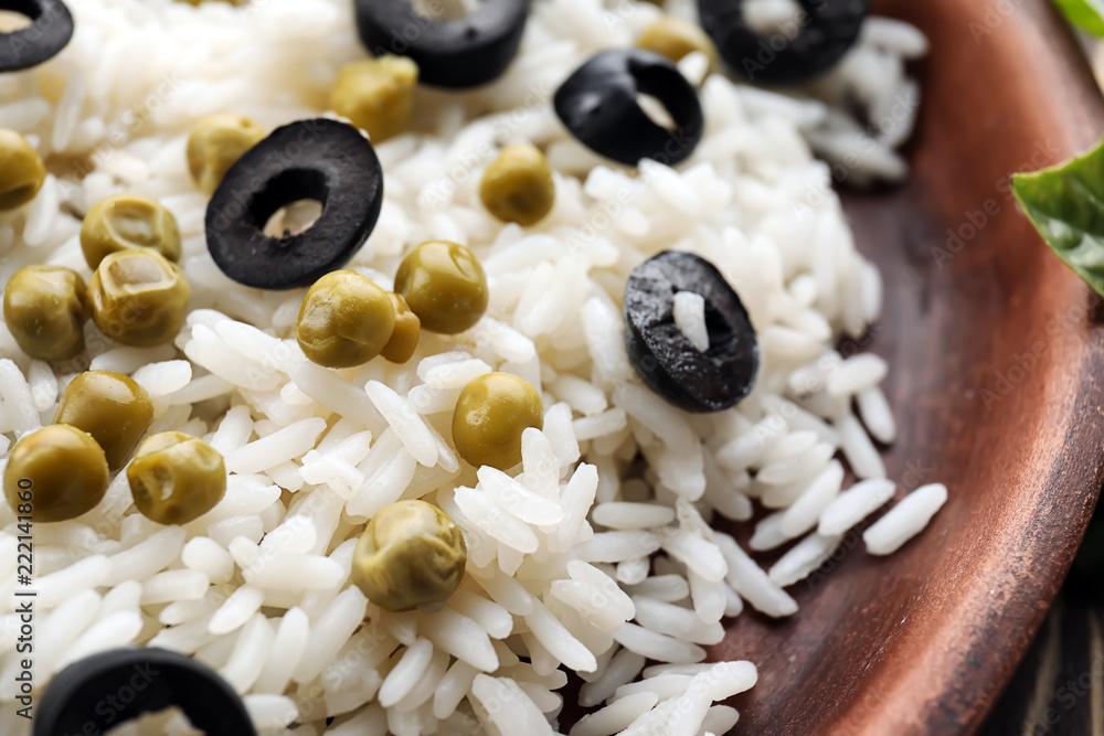 Tasty boiled rice with olives and peas on plate, closeup Stock Photo ...