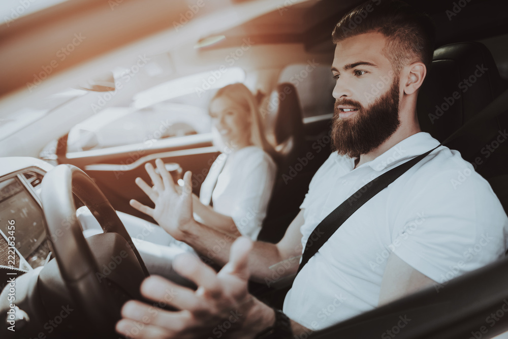 Man Is Driving A Tesla Car. Girl At Front Seat. Stock Photo | Adobe Stock