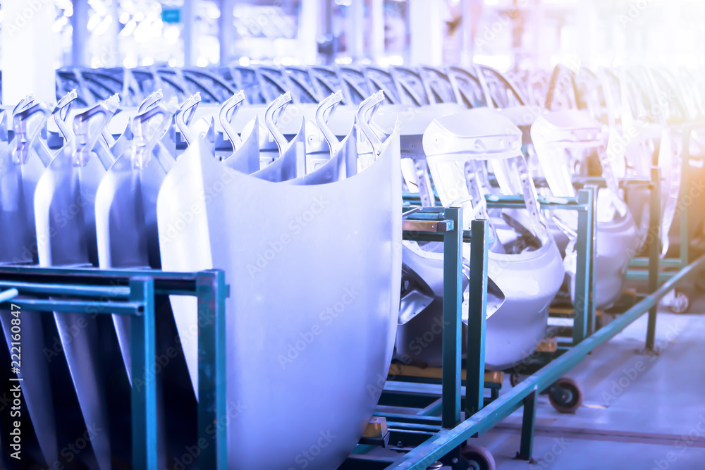 In the car manufacturing plant, the car door frame is waiting to be ...