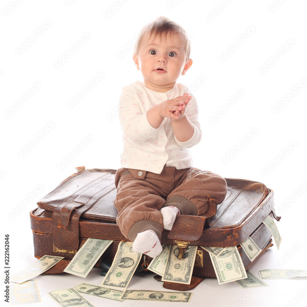 Cute little baby sitting on an old suitcase full of banknotes Stock ...