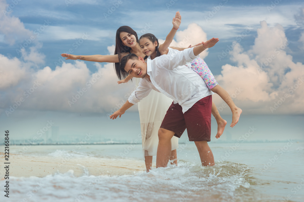 Happy asian family, father, mother, kid, all hands hand up in the airs ...