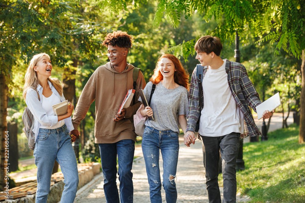 Group of laughing student walking at the campus Stock Photo | Adobe Stock
