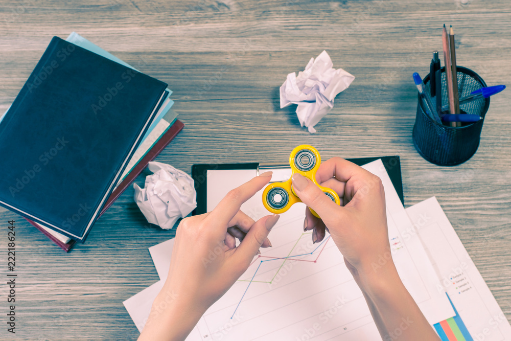 Poster Concept of using fidget spinner at work while having a break ...
