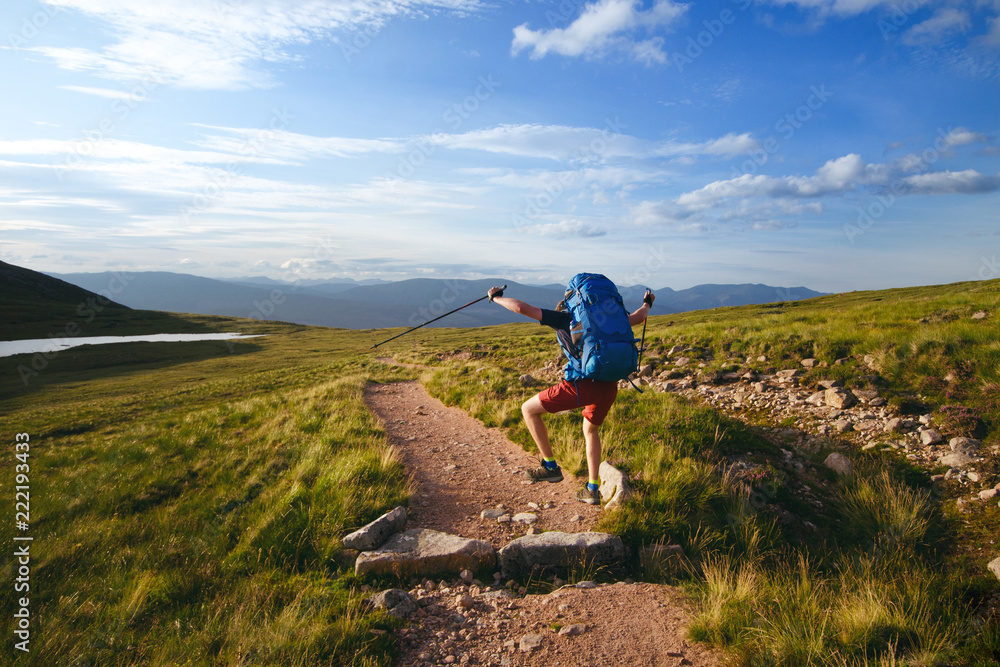 Tourist friends on a top of mountains in a Scottish Highlands. Scotland ...