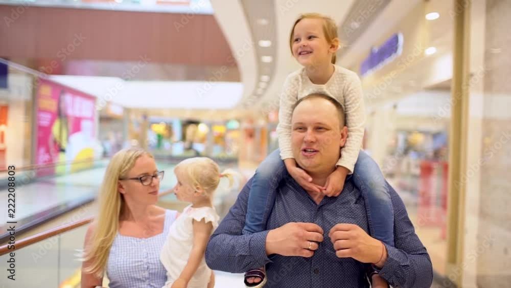 Happy family of four doing shopping. Family in mall. Children At Mall ...
