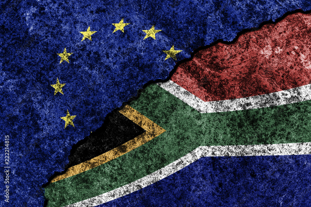 two flags of the European Union and South Africa on a cracked concrete ...