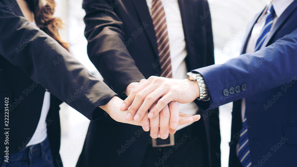 Business People teamwork stacking hands showing unity , teamwork ...