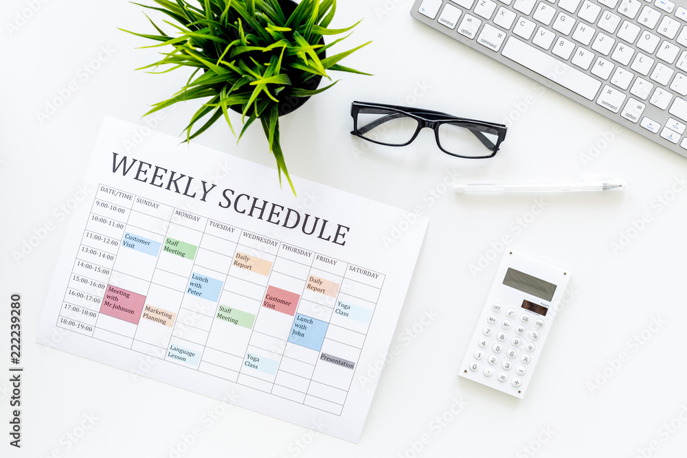 Weekly schedule. Planning the week. Multicolored planner on manager ...