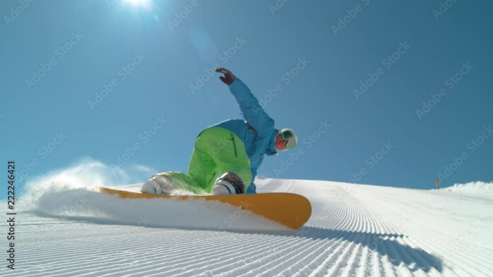 SLOW MOTION CLOSE UP: Extreme snowboarder carving downhill and spraying ...