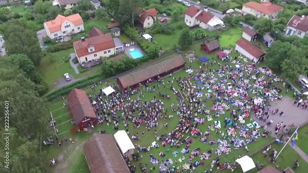 Midsummer celebration in Sweden. Dance around the pole drone view from ...