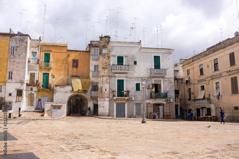 Mediterranean square with ancient buildings with television antennas ...