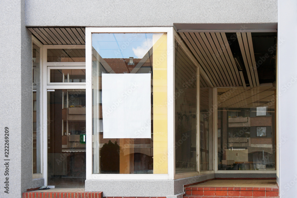 blank sign in empty store window Stock Photo | Adobe Stock