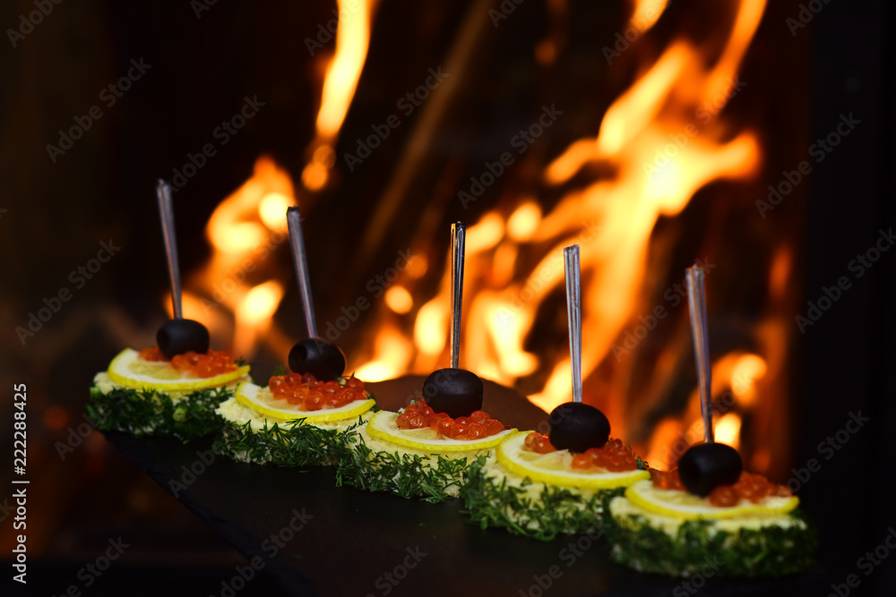 Delicious canapes with red caviar appetizers. Appetizers in portions of ...