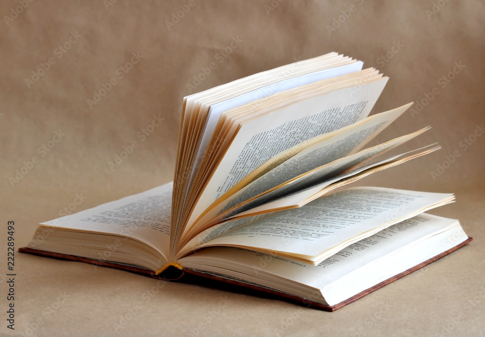 open book on a beige background. Education and knowledge background ...