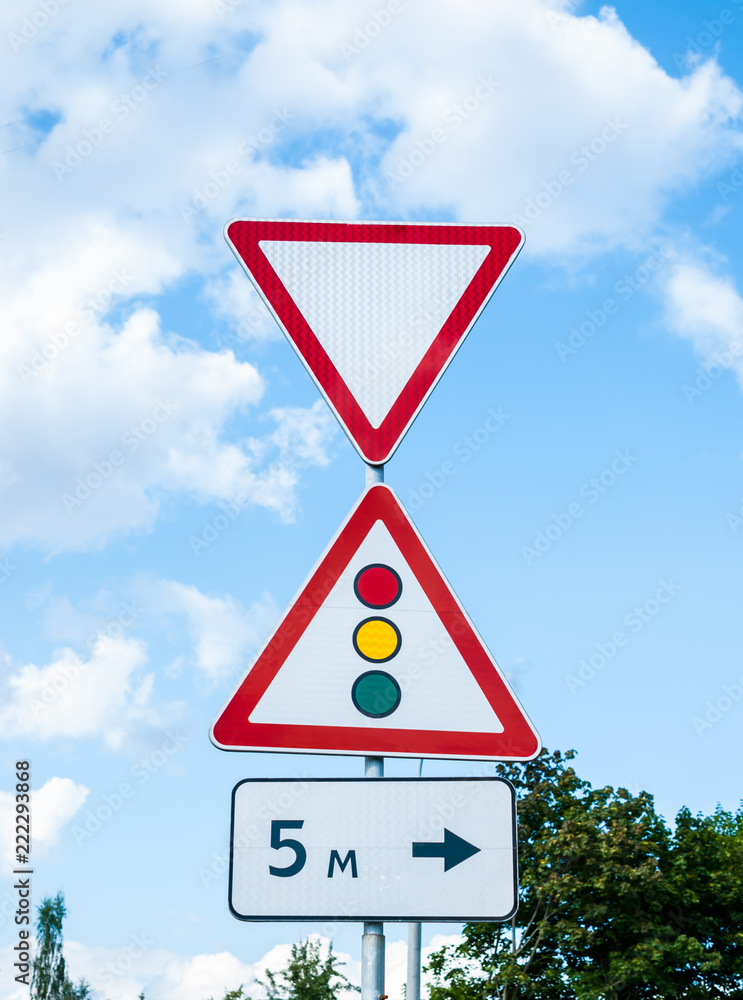 Give way road sign and traffic light Stock Photo | Adobe Stock