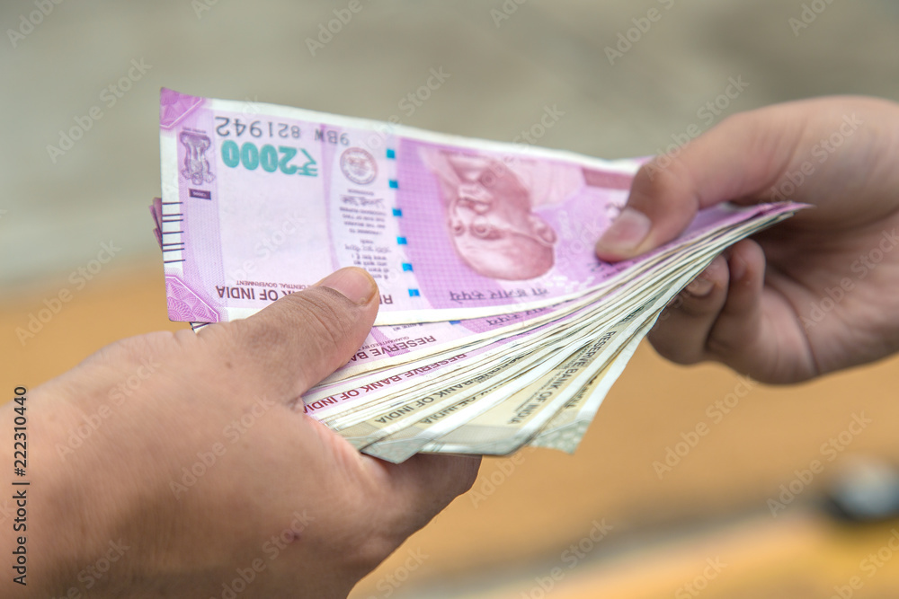 Indian rupees. Holding and giving Indian rupees to someone Stock Photo ...
