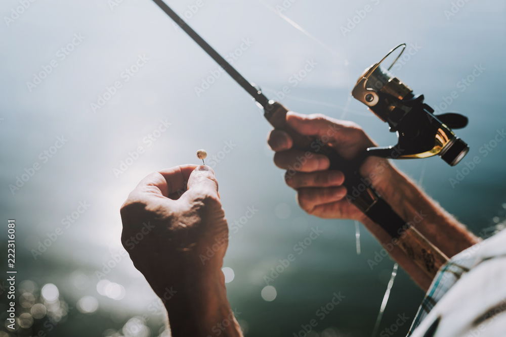 Foto de Old Man with Gray Hair Fishing on River in Summer. do Stock ...