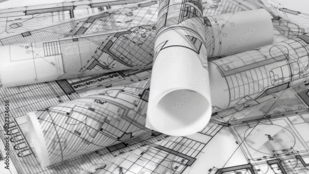 Blueprints - rolls of architectural drawings smoothly rotate on the ...