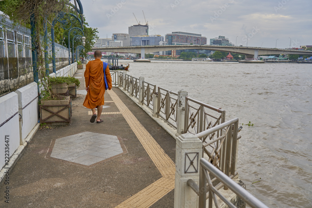 Photo Monk walks on causeway for ferries in Bangkok, David | Posters ...