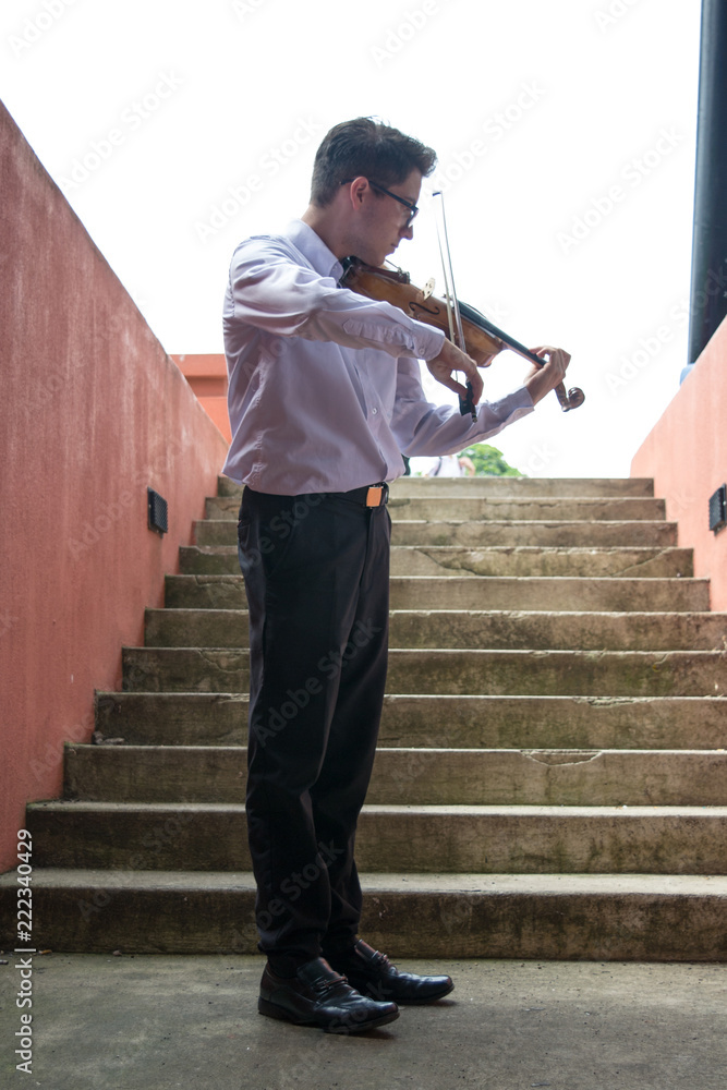 Man Standing Playing Violin