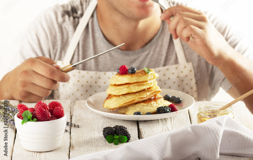 Man Eating Pancakes