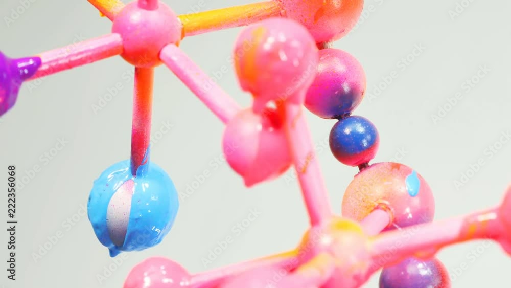 close up color of atom in heart shape are dripping. construction of ...